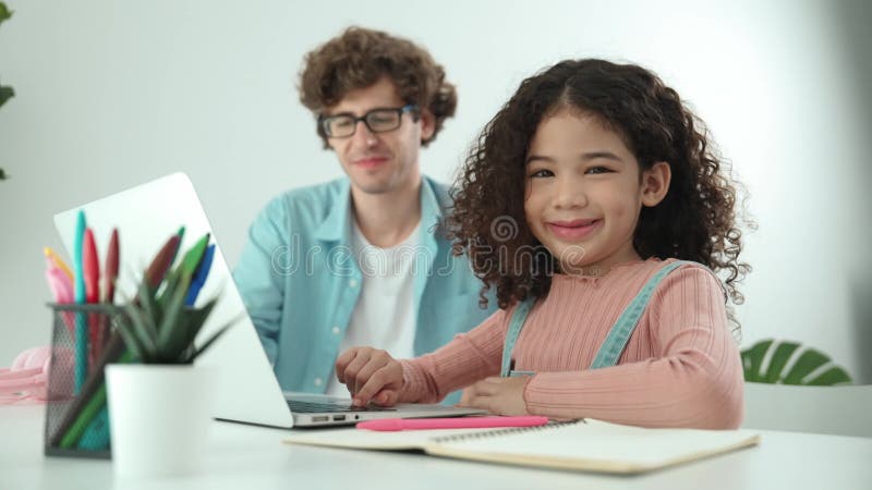 American Student Looking at Camera while Working on Laptop with Dad. Pedagogy. Stock Video ...