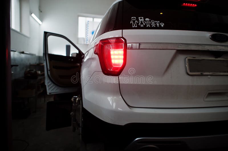 American SUV Car on Stand for Wheels Alignment Camber Check in Workshop ...
