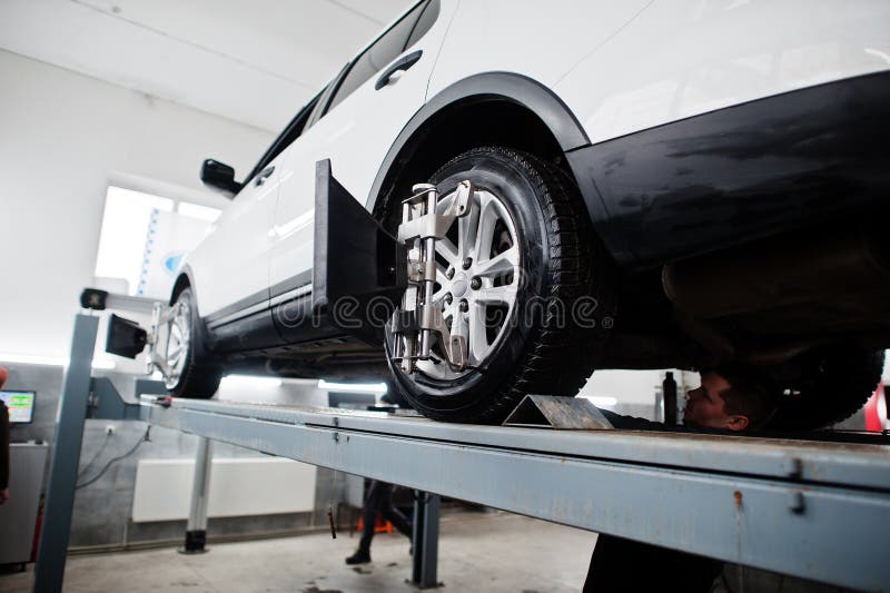American SUV Car on Stand for Wheels Alignment Camber Check in Workshop ...
