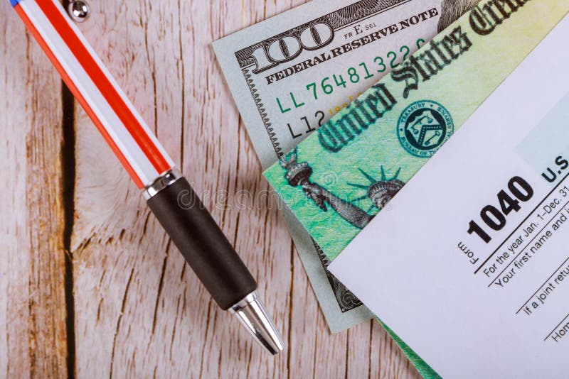 American Tax Form and an Refund Check, US 100 Dollar Bills Editorial ...