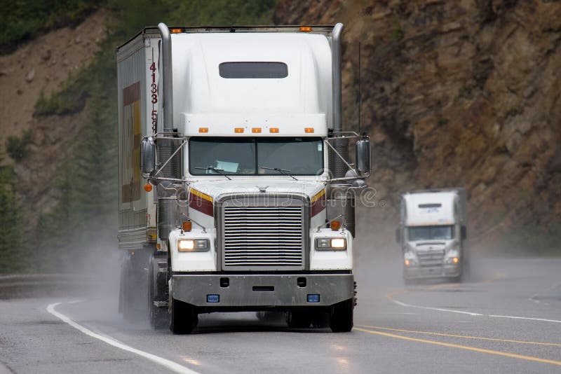 American truck, Two large American trucks on a highway in the