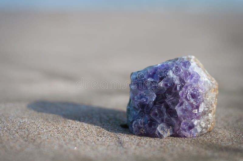 Amethyst on sand stock image. Image of color, spiritual - 99075629