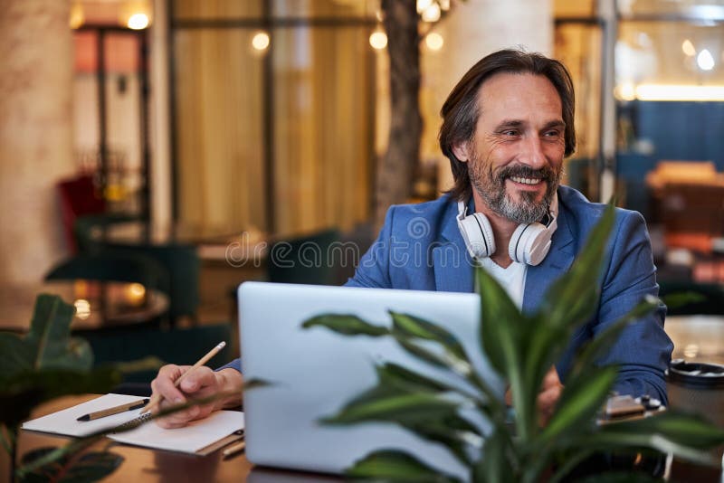 Friendly Gentleman Working Remotely from a Hotel Lounge Stock Image ...