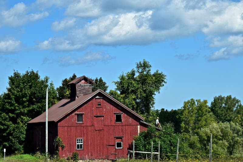 Man working on Barn stock image. Image of community, barns - 44925715