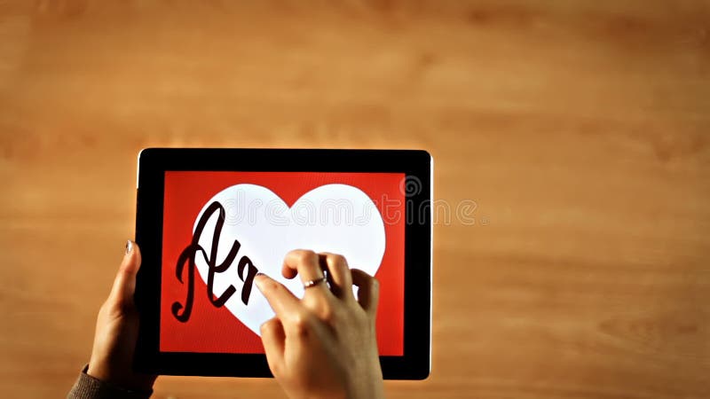 Amor Calligraphy. Female Writing Inside White Heart on Tablet Stock ...