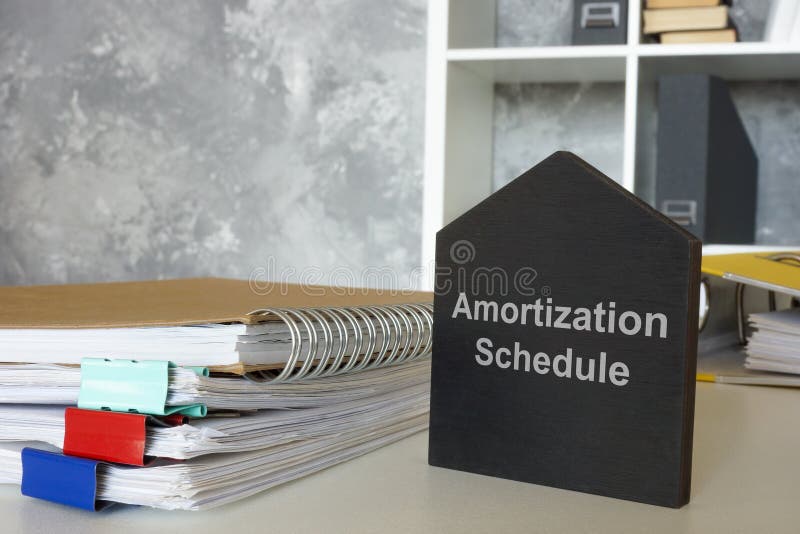 Amortization Schedule and Stack of Documents. Debt Repayment Planning ...