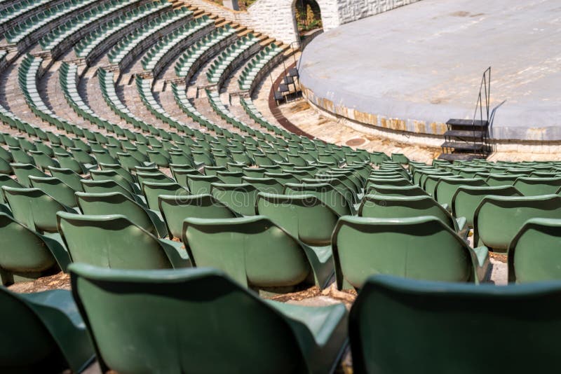 Amphitheater with Concentric Rows of Tiered Seating Curving Around a ...