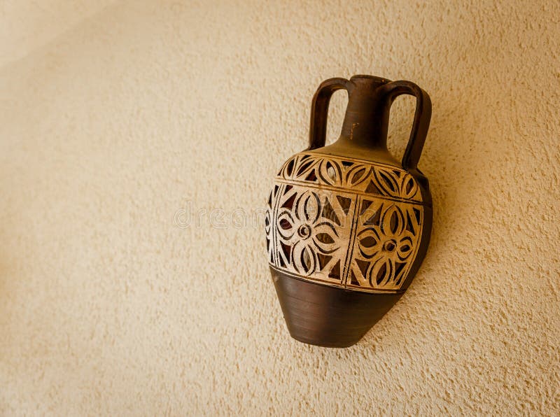 An Amphora Decorating the Wall of a Patio Stock Photo - Image of ...