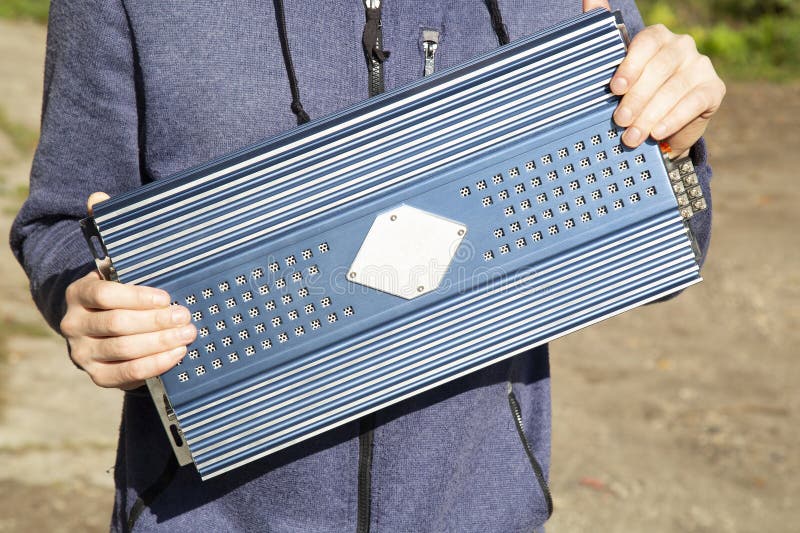 Amplifier for Car Sound in a Car . Car Audio System in the Hands of a ...