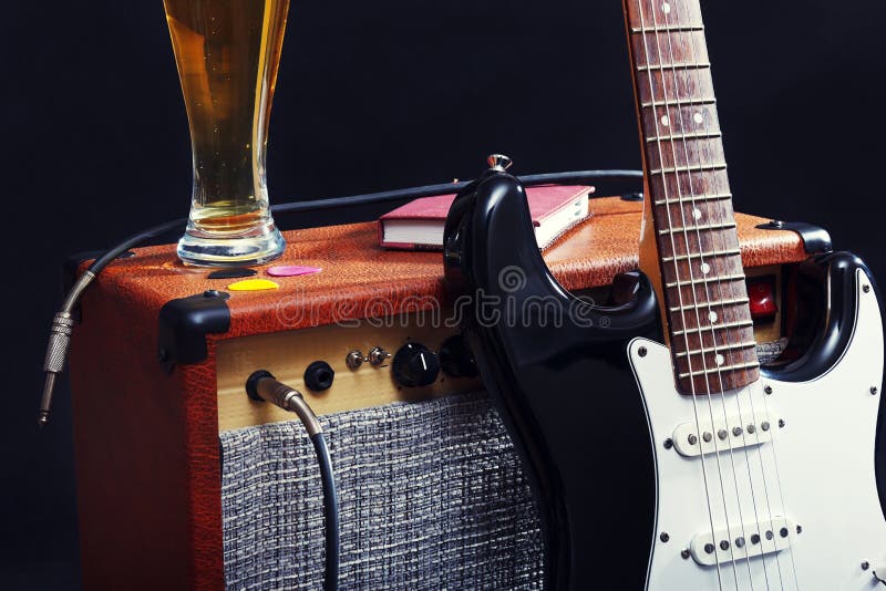 Amplifier for Electric Guitar with Black Guitar, Glass of Beer and ...