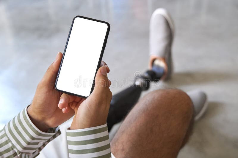 Amputee Man with Leg Prosthesis Sitting on Sofa at Home Using Phone ...