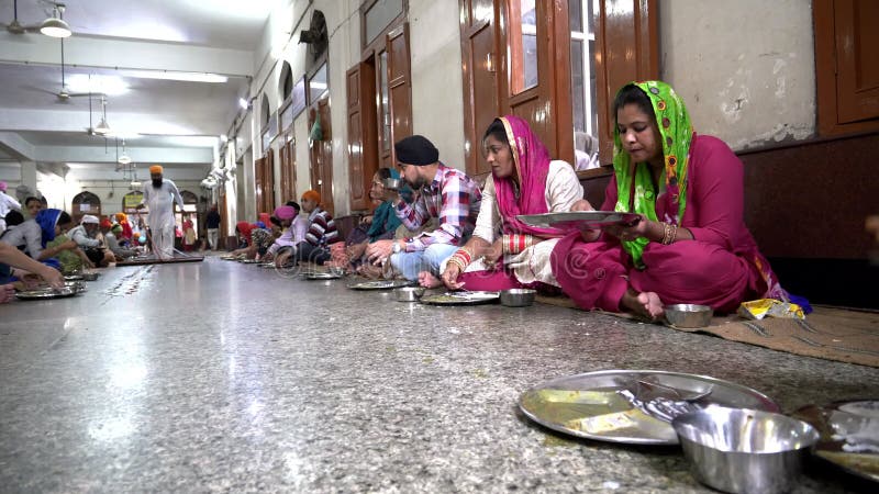 AMRITSAR, INDIA - MARCH 18, 2019: Sikh Man Eating in Golden Temple S ... AMRITSAR, INDIA - MARCH 18, 2019: Sikh Man Eating in Golden Temple S ...