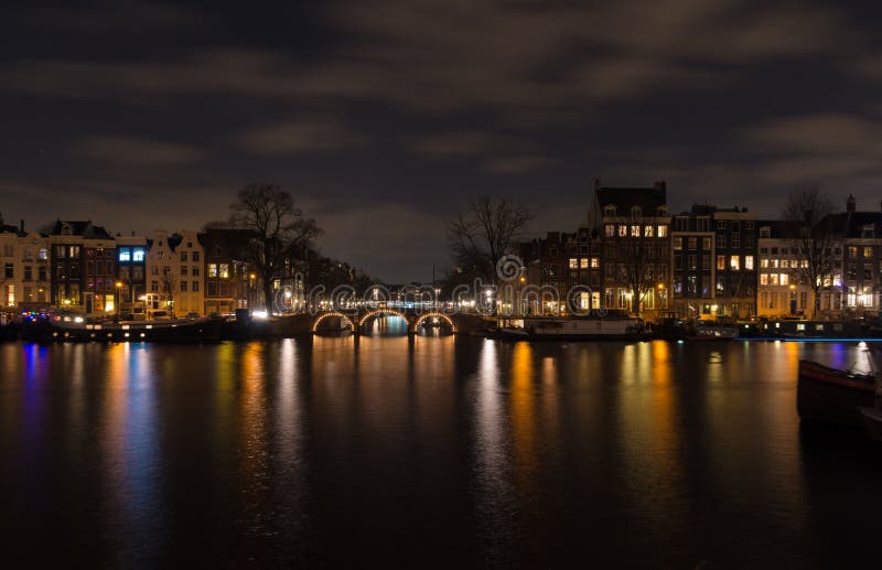 Amsterdam canal at night stock image. Image of building - 58495201