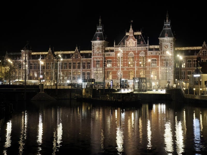 Amsterdam Central Station and Channel View at Night Editorial Stock ...