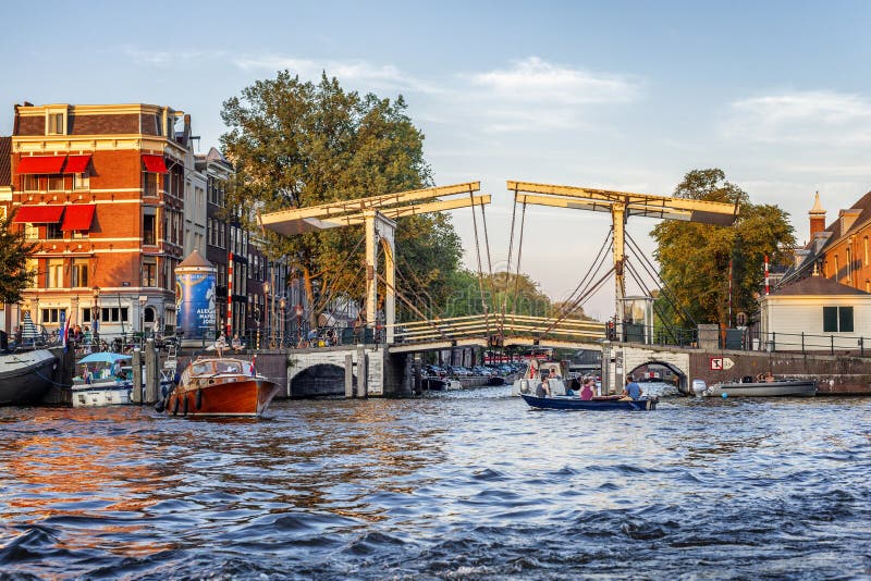 Amsterdam, Netherlands, 08/22/2015: Canal with a Brick Arch in the City ...