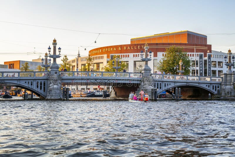 Amsterdam, Netherlands, 08/22/2015: Canal with a Brick Arch in the City ...