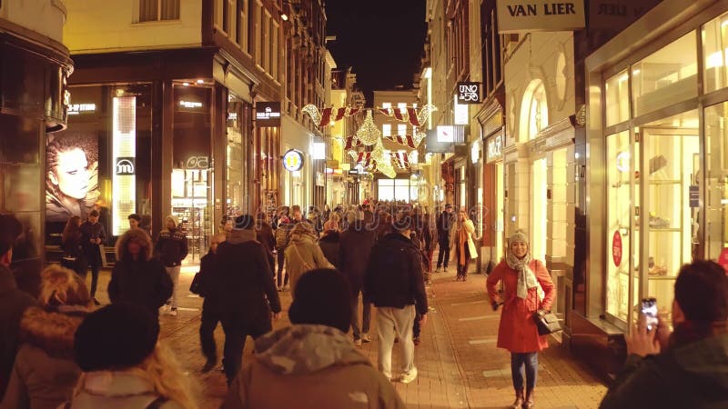 AMSTERDAM, NETHERLANDS - DECEMBER 28, 2017. Crowded Decorated Street ...