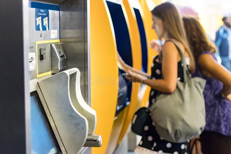 A Self-service Automatic Ticket Machine with Blurred Passengers in the ...