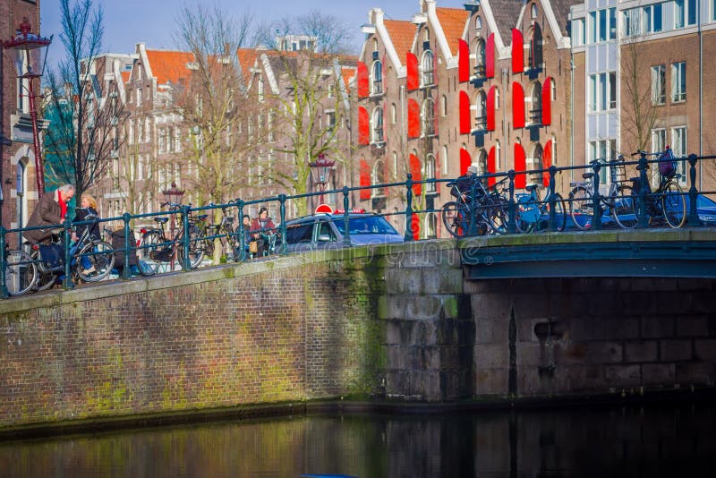 AMSTERDAM, NETHERLANDS, MARCH, 10 2018: People Walk on an Old Stone ...