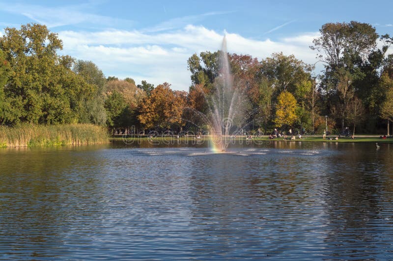 Rainbow Over Fountain in Lake of Vondelpark at the Sunset Editorial ... Rainbow Over Fountain in Lake of Vondelpark at the Sunset Editorial ...