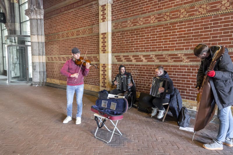 Group of Street Musicians Performing in Amsterdam, Netherlands ...