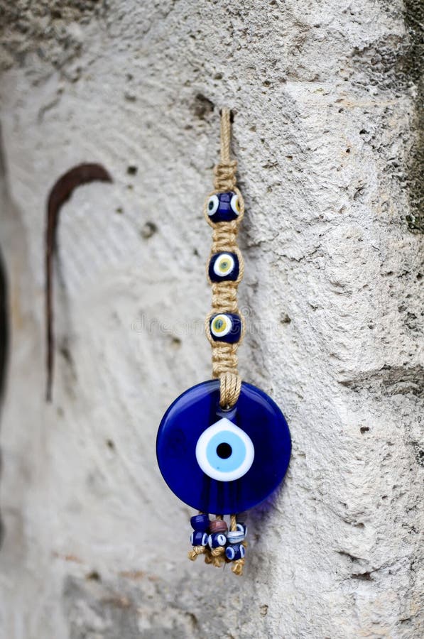 Amulet the Blue Turkish Evel Eye on Wall. Stock Image - Image of hand ...