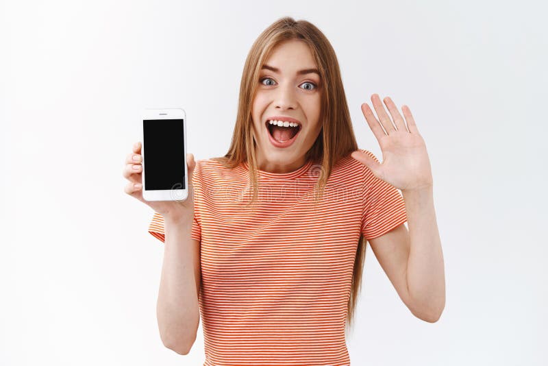 Pretty Cheerful Young Caucasian Woman In Striped T Shirt Holding