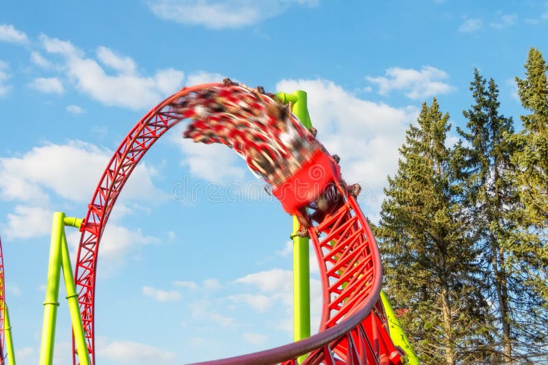 Amusement Cart Makes Circular Loops Upside Down and Turns Sharply Out ...
