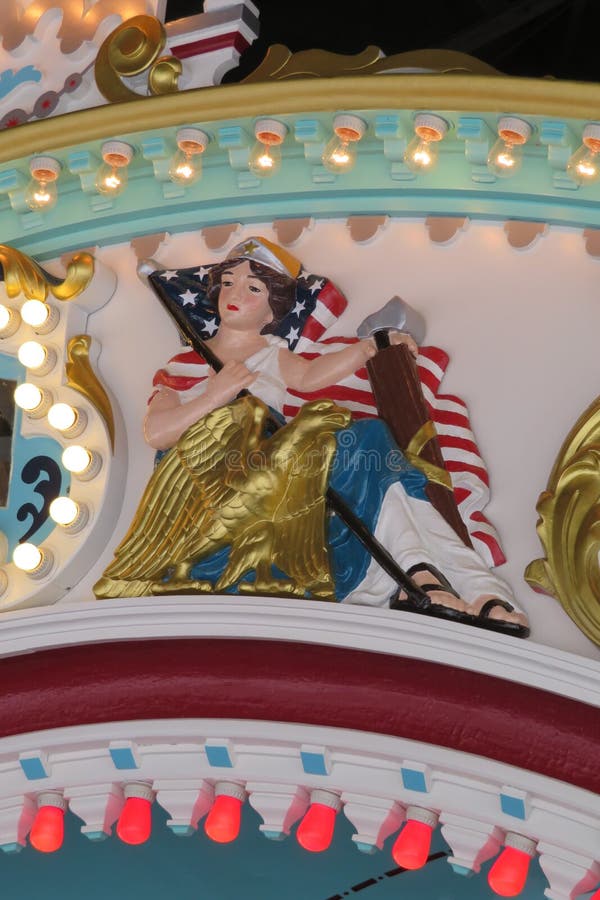 Amusement Park Carousel Lady with Flag on Cresting with Lights Stock ...