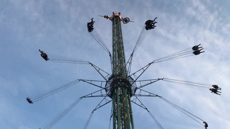 Amusement Park Carousel at the Top with a Blue Sky in Background from ...