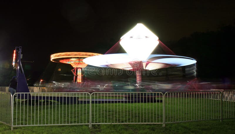 Amusement rides at night stock image. Image of light, flying - 5184051