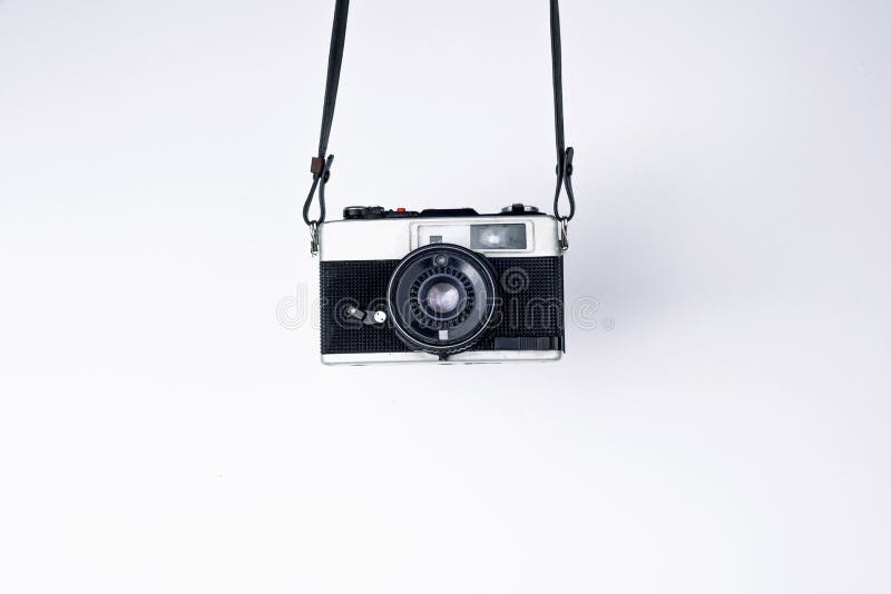 Analog Camera Hanging on a White Wall Stock Image - Image of white ...
