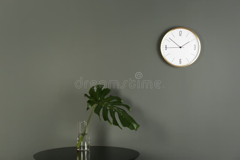 Analog Clock on Grey Wall Indoors Stock Photo - Image of countdown ...