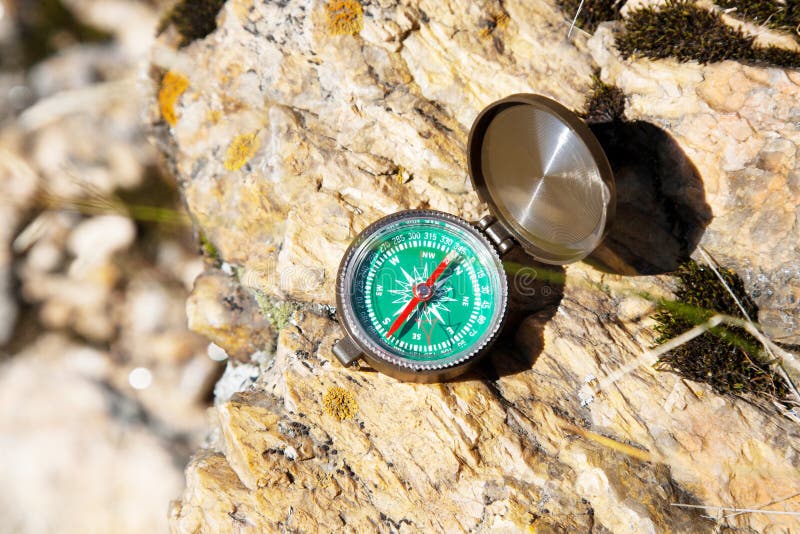 Analogic Compass Abandoned on the Rocks Stock Photo - Image of concept ...