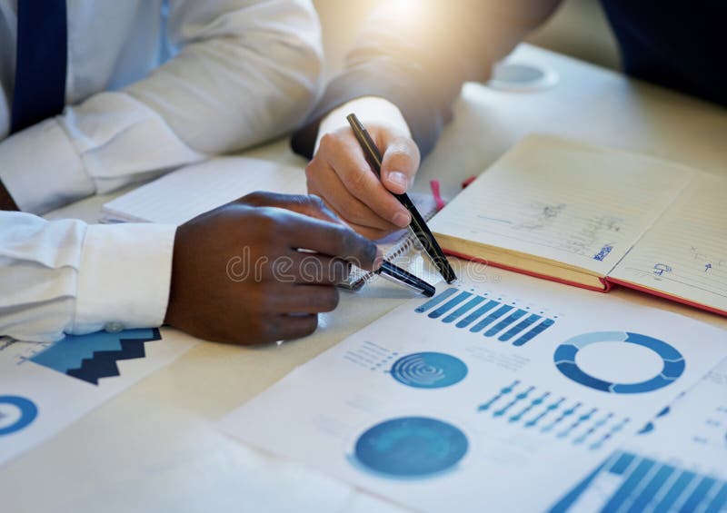 Analysing the Latest Business Reports. Two Unrecognisable Businessmen ...