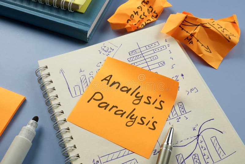 Analysis Paralysis Concept. Notepad with Graphs and a Sticker with the ...