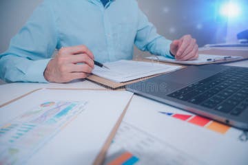 Analyst Man Working with Data Chart on Desk in Office Using KPI ...