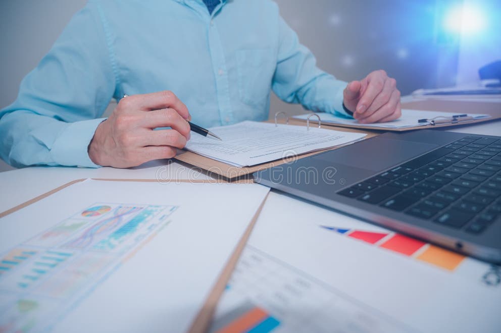 Analyst Man Working with Data Chart on Desk in Office Using KPI ...