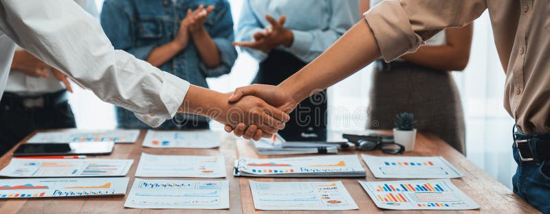 Analyst Team Celebrates Successful Data Analysis with Handshake ...