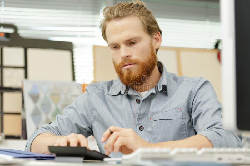 Analyze Business Data Data with Business Men Using Office Calculators ...