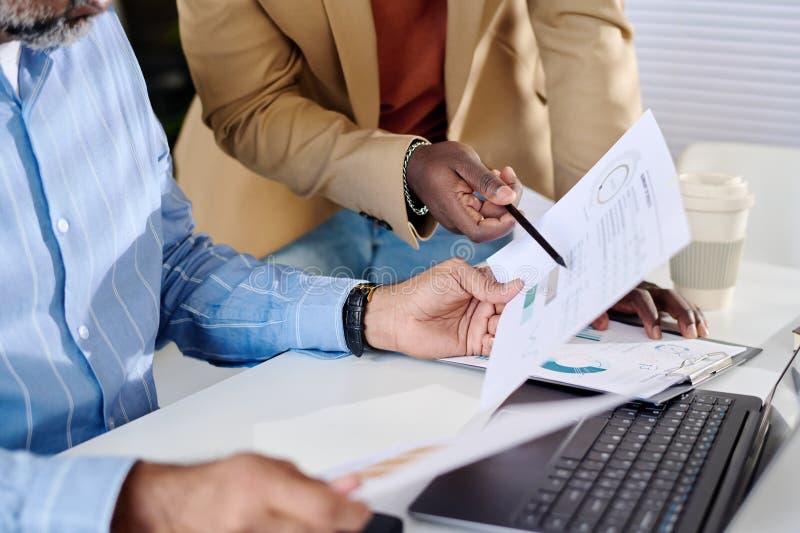 Analyzing Business Reports in Modern Office Environment Stock Photo ...