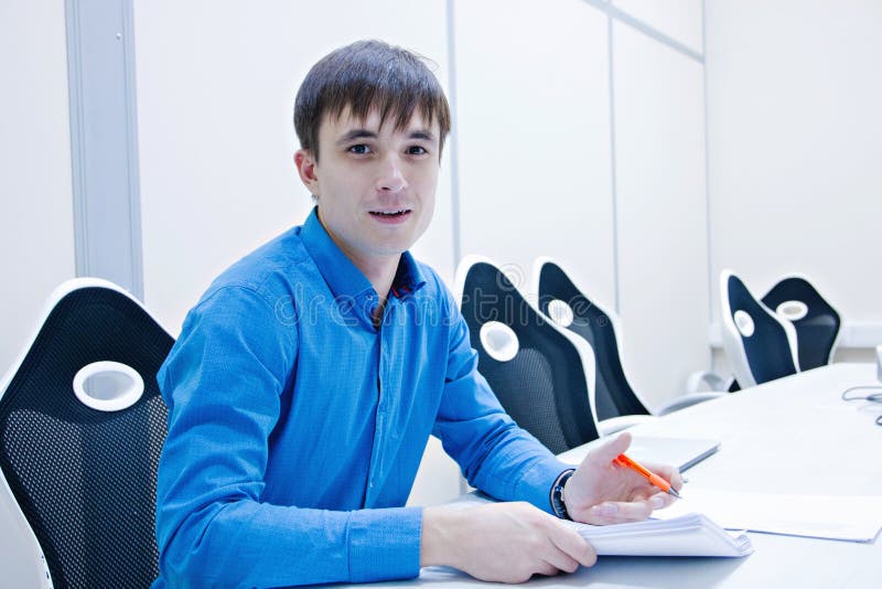 Analyzing Charts and Reports.the Smilling Man Checks the Data in the ...