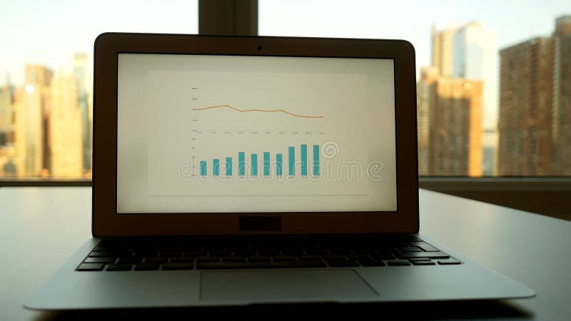 Analyzing Corporate Business Finance Data Charts on Computer Screen ...