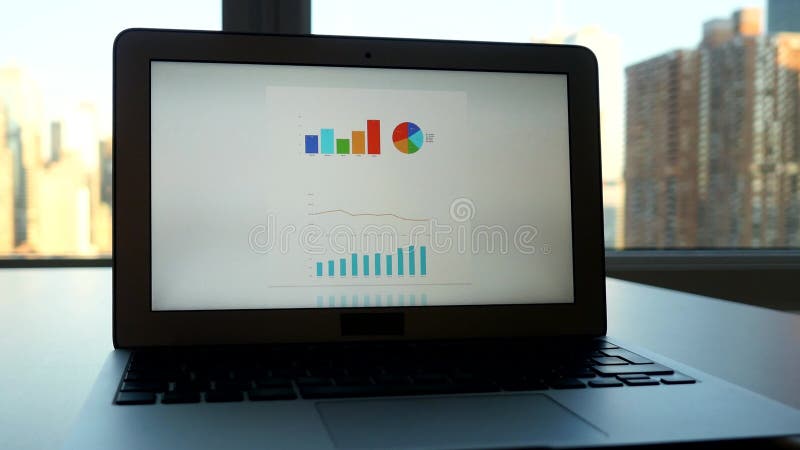 Analyzing Corporate Business Finance Data Charts on Computer Screen ...