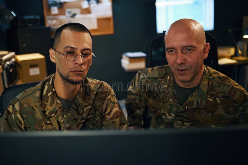 Analyzing Data in Military Office Setting Stock Photo - Image of ...