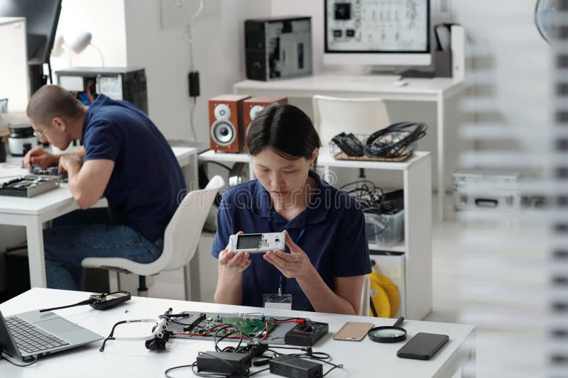 Analyzing Electronic Devices in Tech Laboratory Setting Stock Photo ...