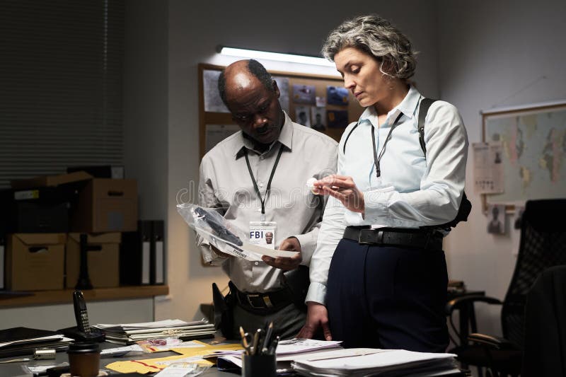 Analyzing Evidence in Office Case Investigation Scene Stock Photo ...