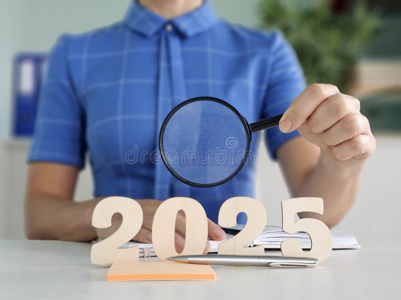 Analyzing Future Trends for 2025 with a Magnifying Glass Stock Image ...