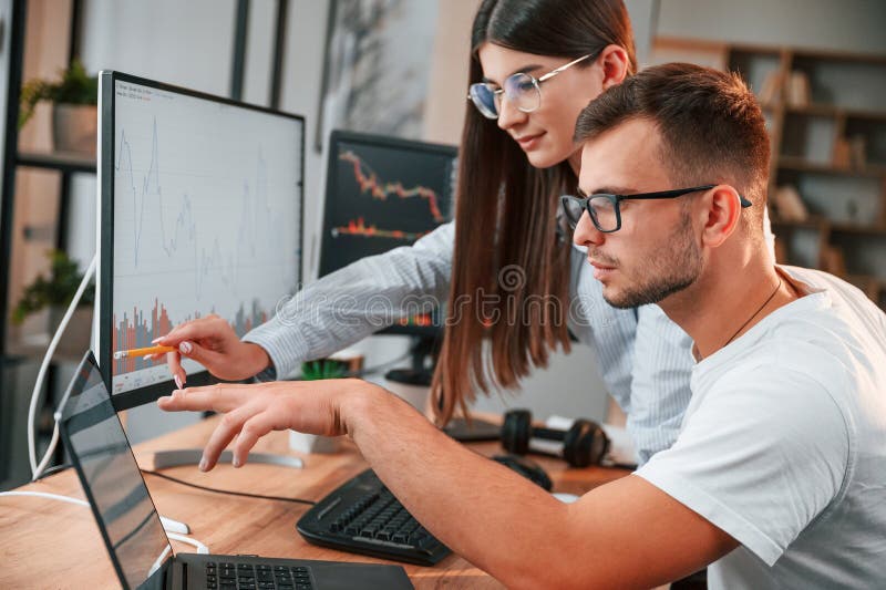 Analyzing Information from Computer Screens. Two Stock Brokers is ...