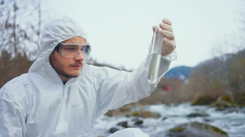 A Serious and Focused Portrait of a Scientist Tests the Water Quality ...